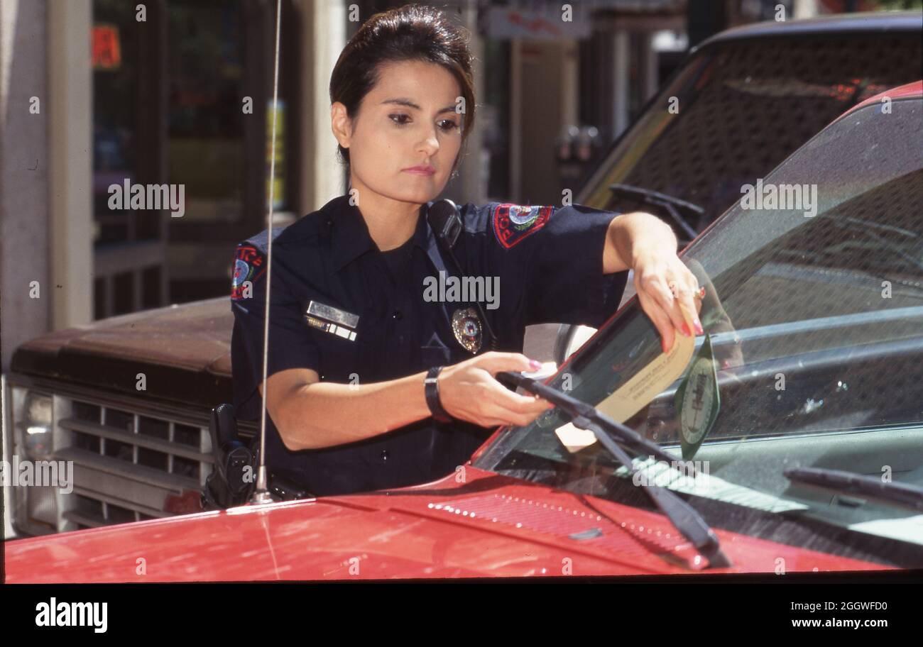 ©1997 Hispanic female police officer balances work with family life ...