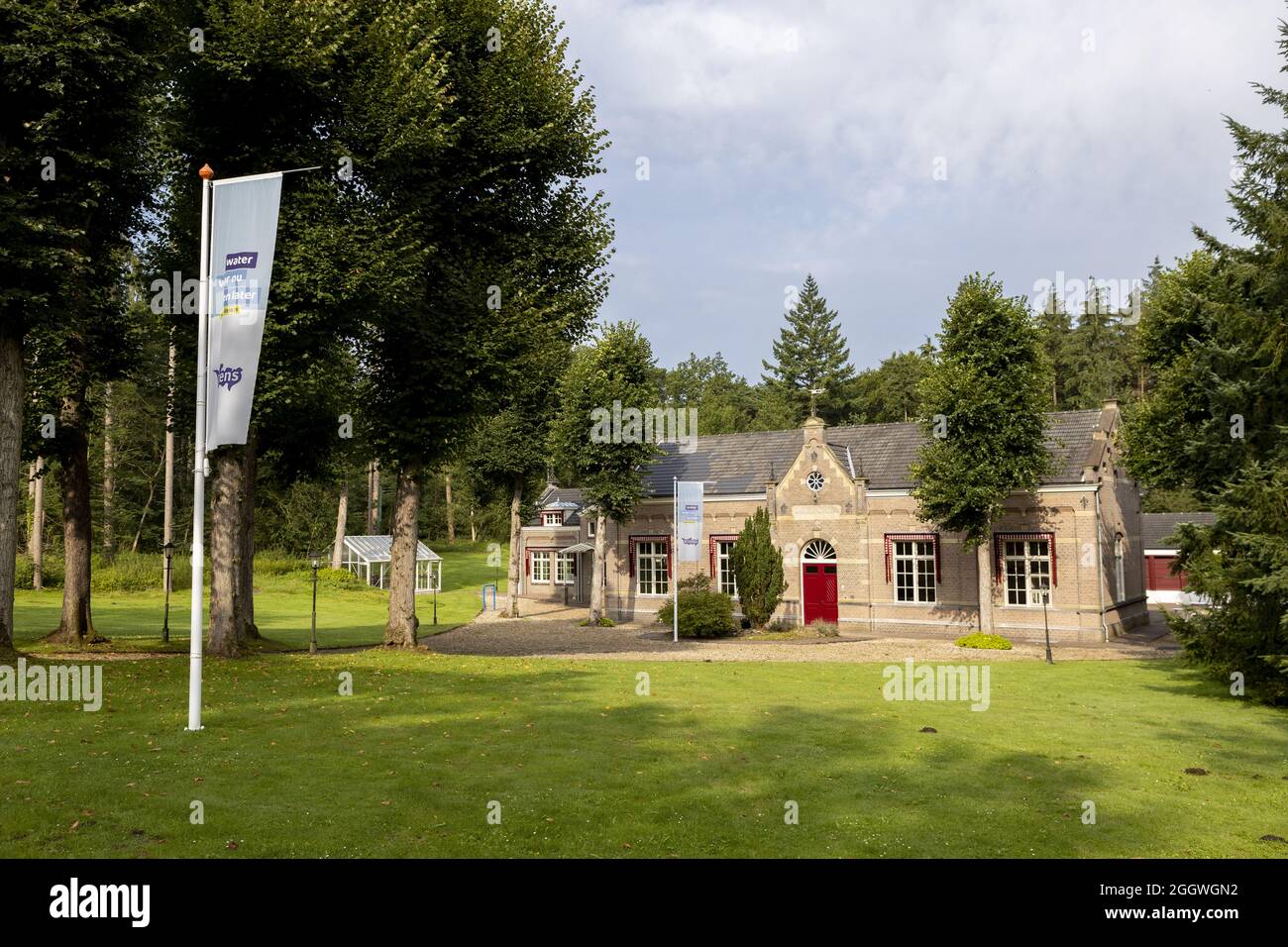 ZUTPHEN, NETHERLANDS - Aug 21, 2021: Flag with company logo in front of ...