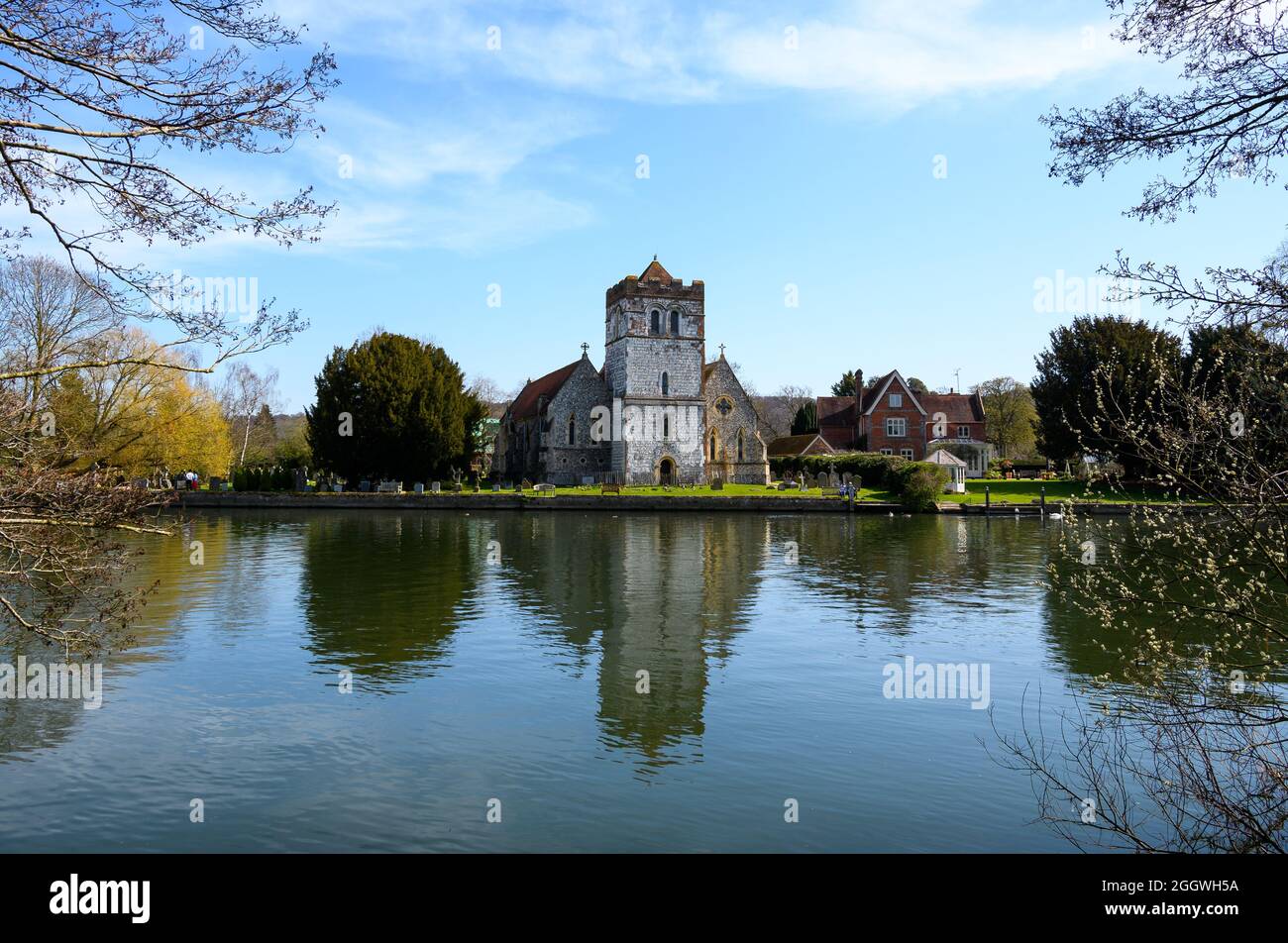 All Saints Church Bisham reflected in the waters of the river Thames ...