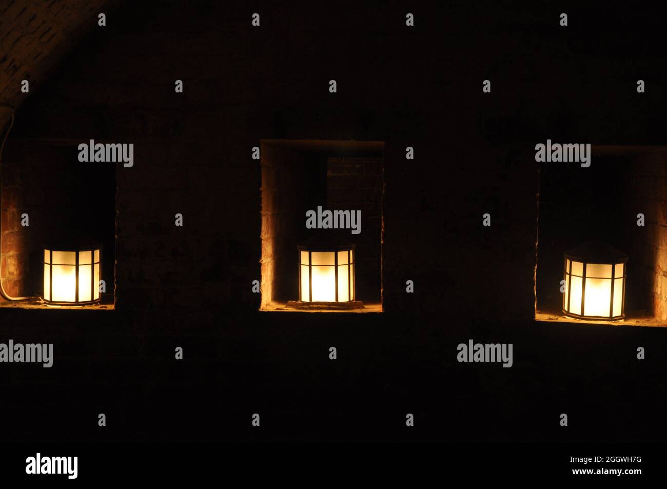 Three lanterns lit in the dark Artillery storage in Hurst Castle Stock ...