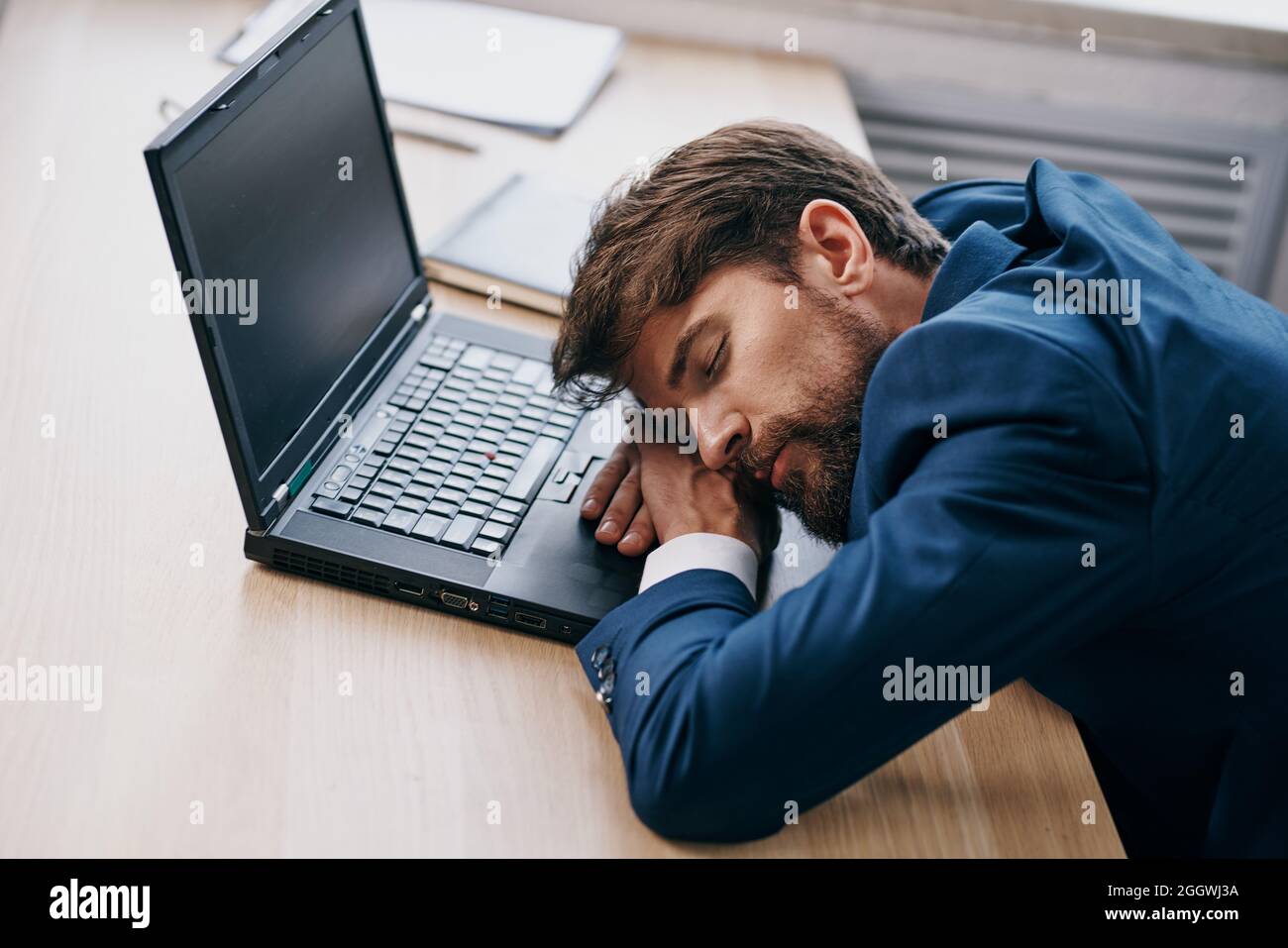 business man sleeping in front of laptop at his desk office Stock Photo ...