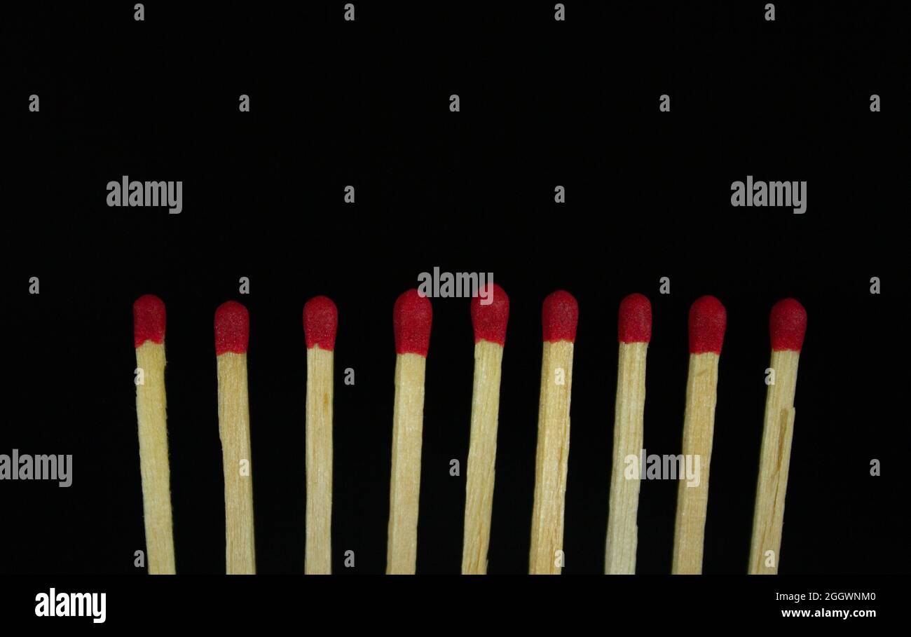 row of red matches isolated on black background with copy space Stock ...
