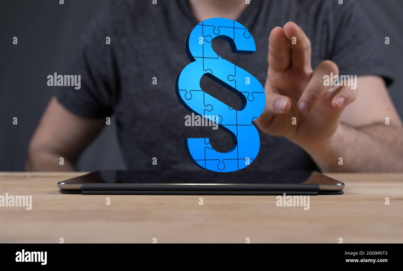 Person presenting a 3D render of paragraph law signs Stock Photo - Alamy