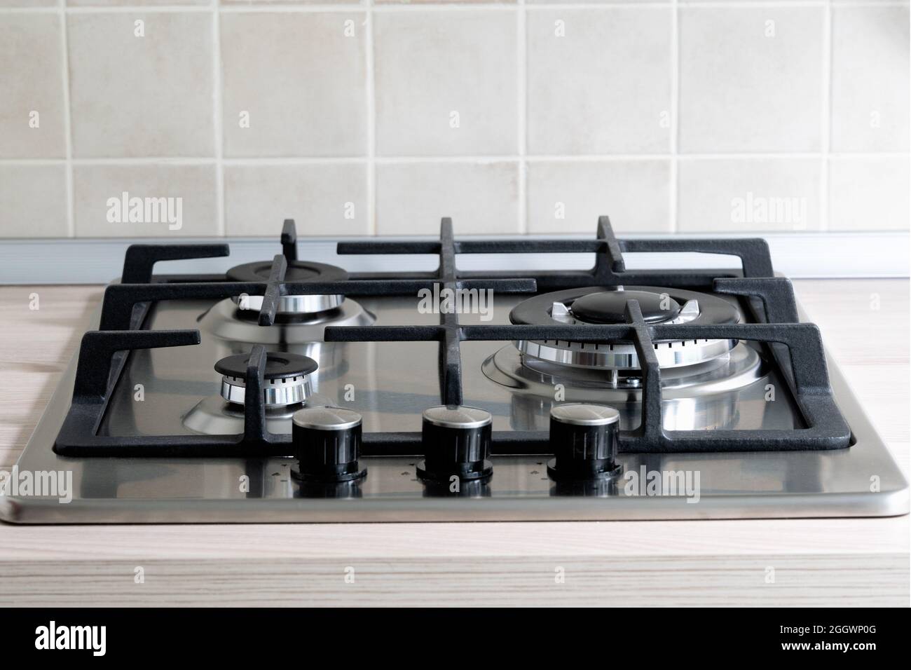 Stainless steel gas hob on the countertop Stock Photo - Alamy