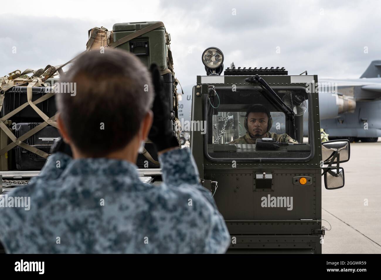 A Republic of Singapore Air Force personnel guides U.S. Air Force Staff ...