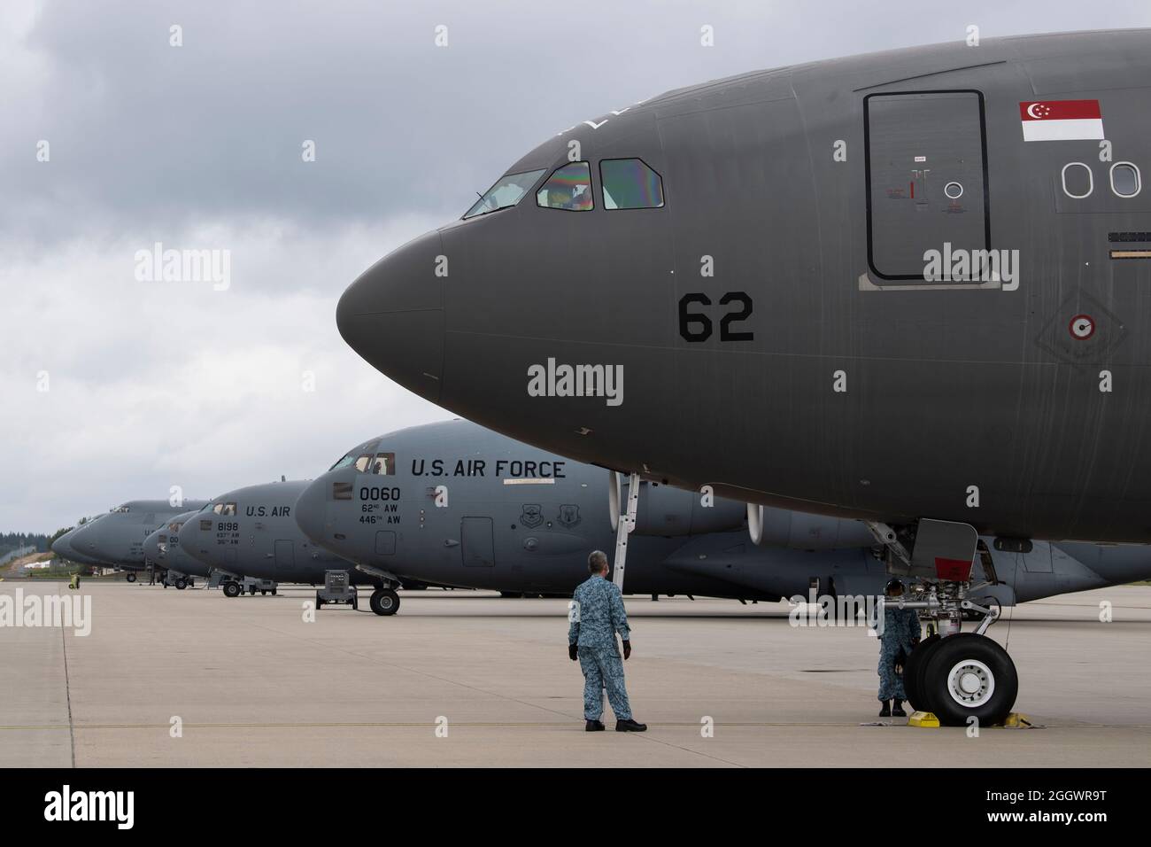 Republic of Singapore Air Force personnel perform pre-flight checks on ...