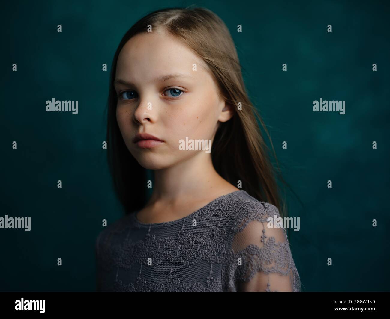 cute girl emotions depression green background Stock Photo - Alamy