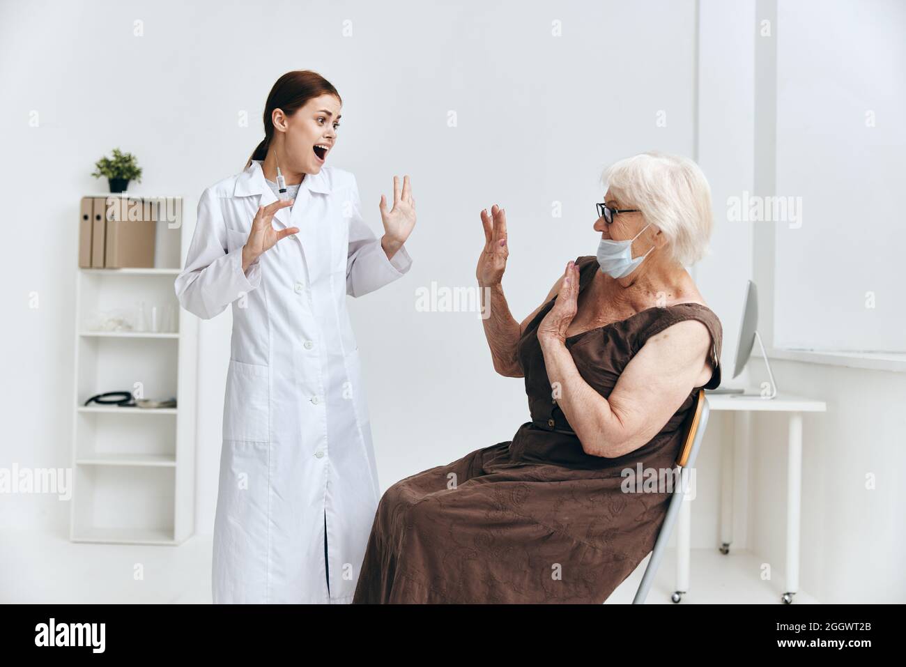 Emotional Nurse And Patient Syringe Injection Hospital Stock Photo - Alamy