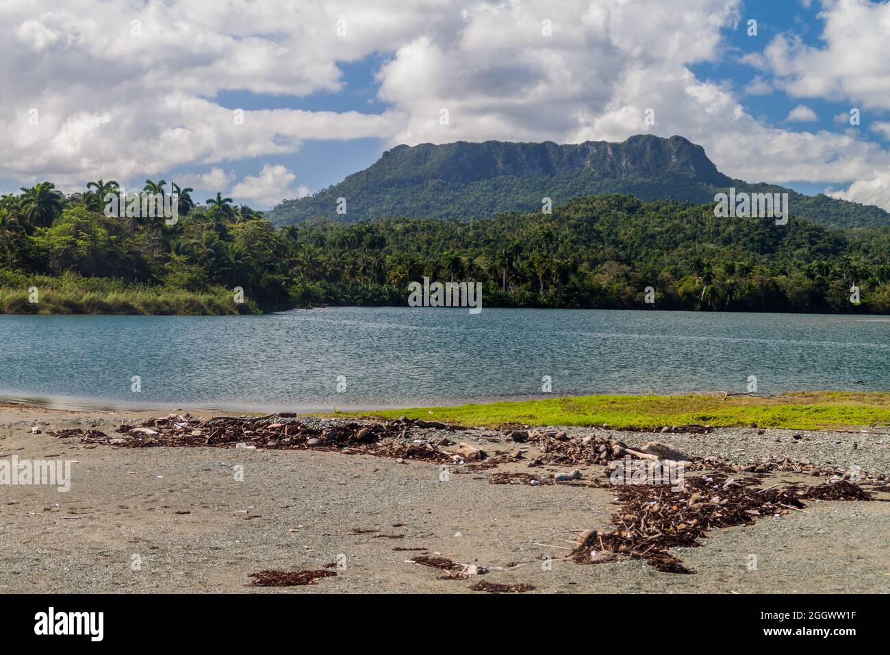 Beach at the mouth of Rio Toa river near Baracoa, Cuba. El Yunque ...