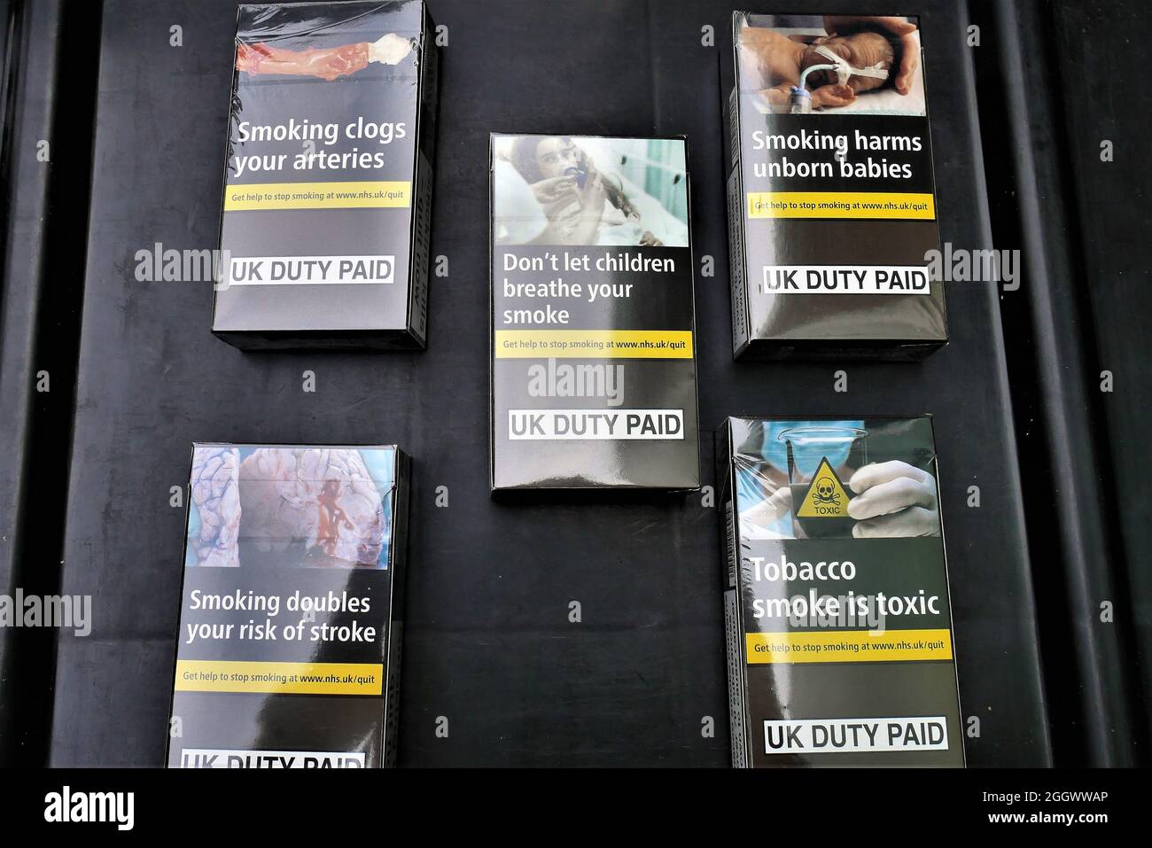 Five Cigarette Packs with different UK Health Warnings Stock Photo - Alamy