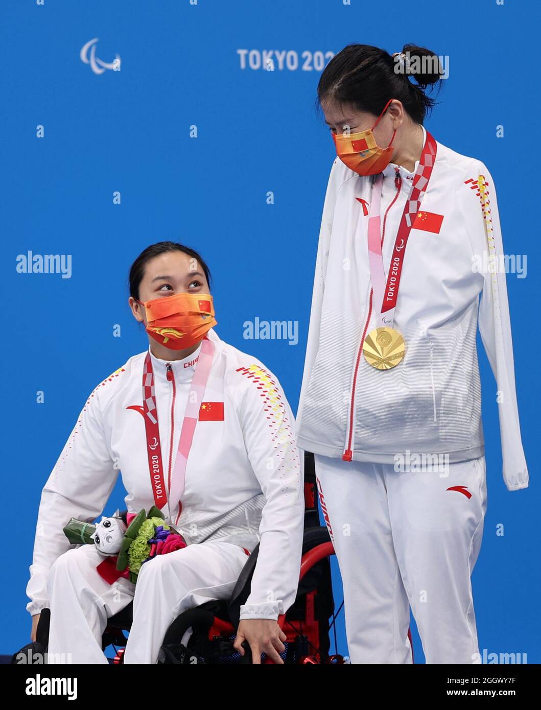 Tokyo, Japan. 3rd Sep, 2021. Gold medalist Lu Dong (R) of China poses ...