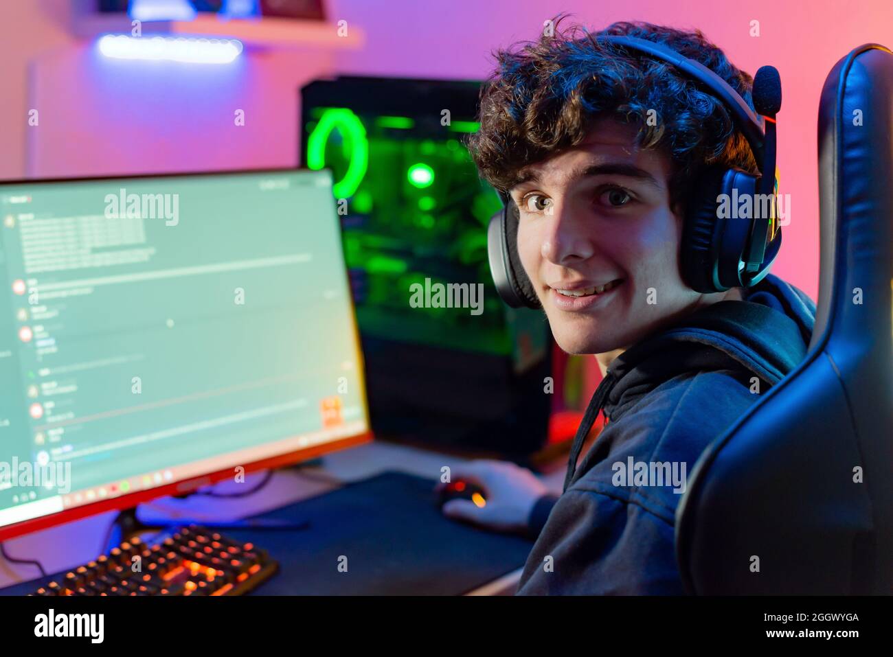 Happy gamer chatting on computer Stock Photo - Alamy