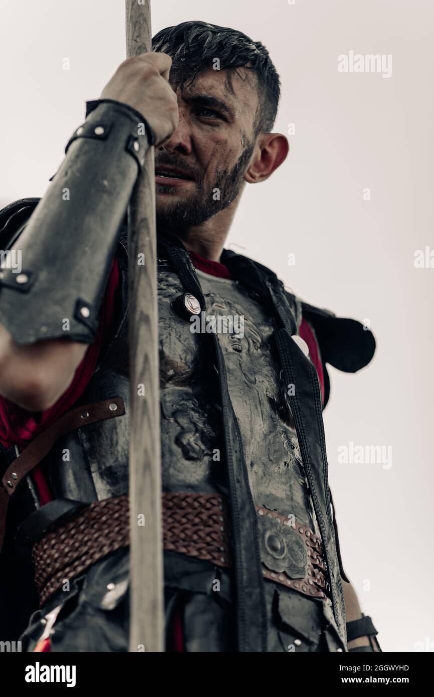 Portrait of ancient Spartan warrior in armor with spear in his hand ...