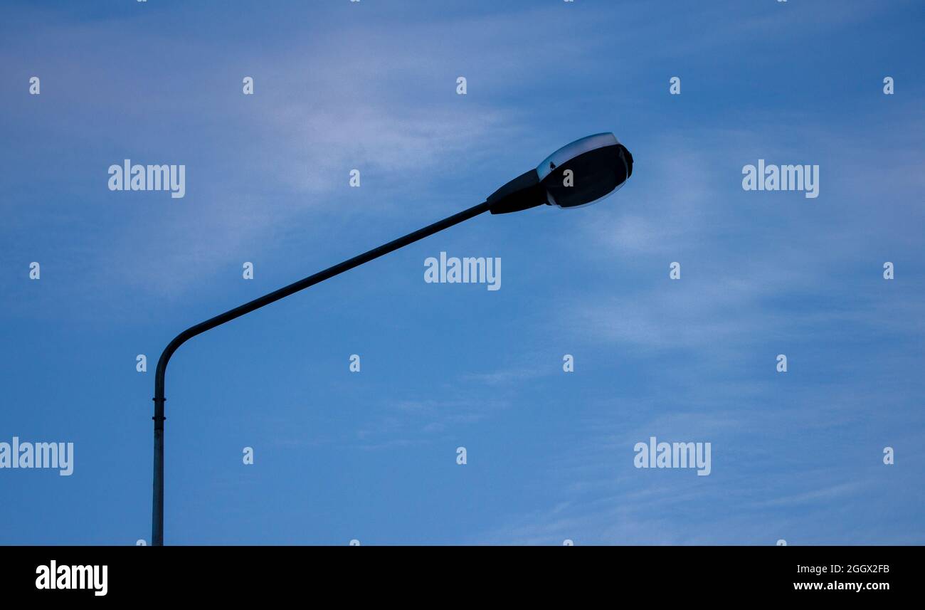 a lonely street light in blue sky Stock Photo - Alamy
