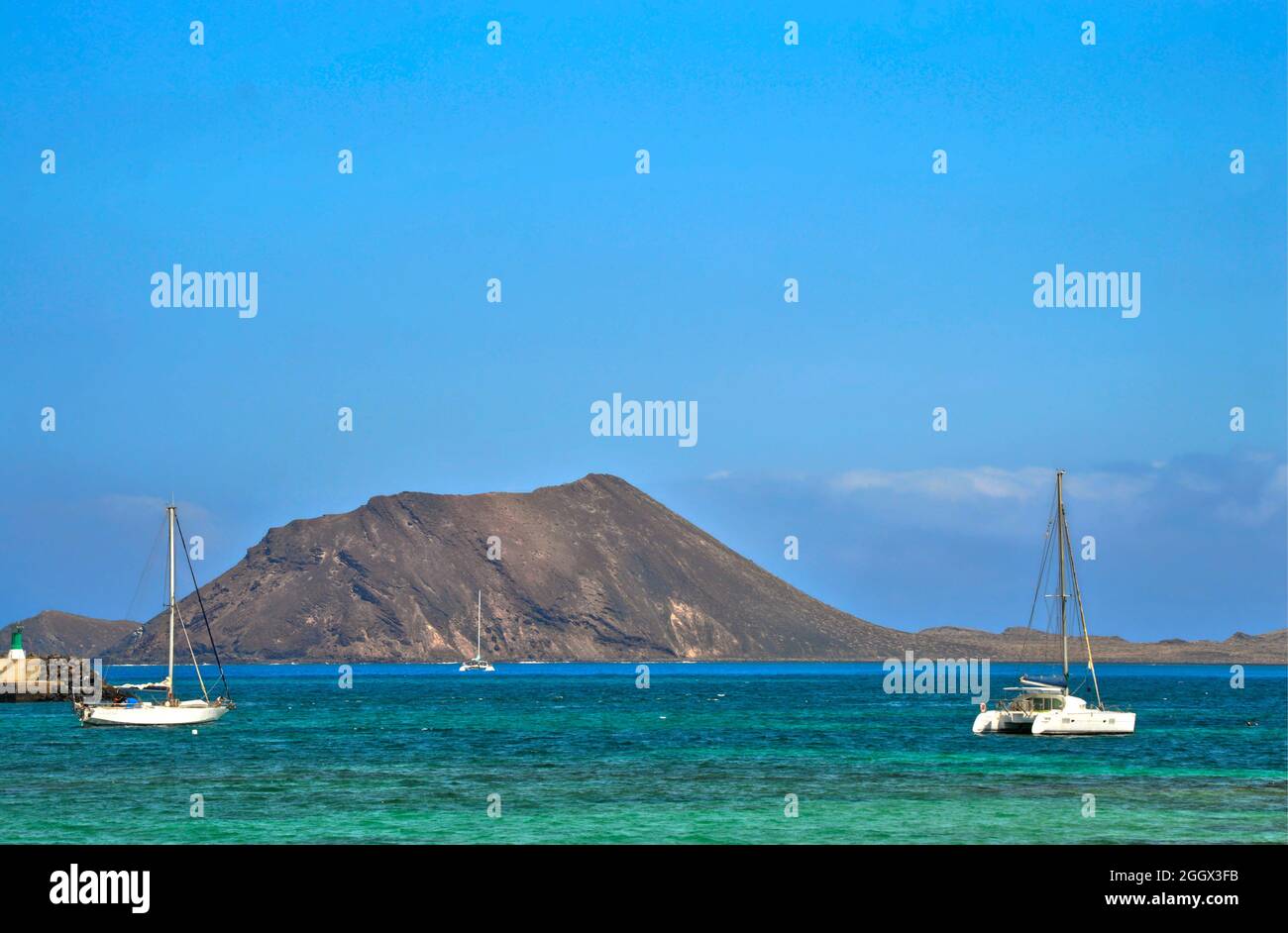 Isla de Lobos with boats a volcanic island off the coast of ...