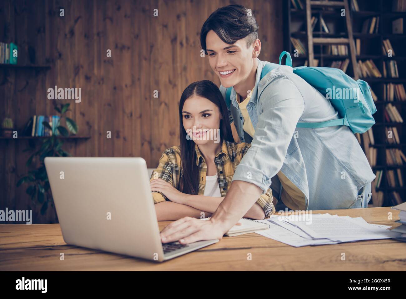 Portrait of two attractive busy focused creative cheery pupils doint ...
