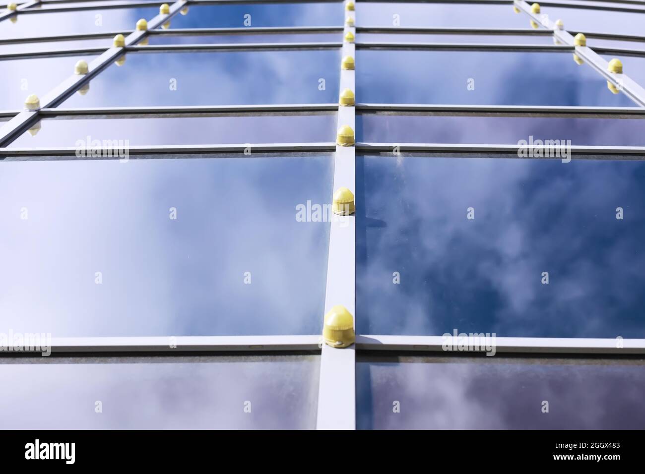 Architectural detail of the facade with multiple reflections of other ...