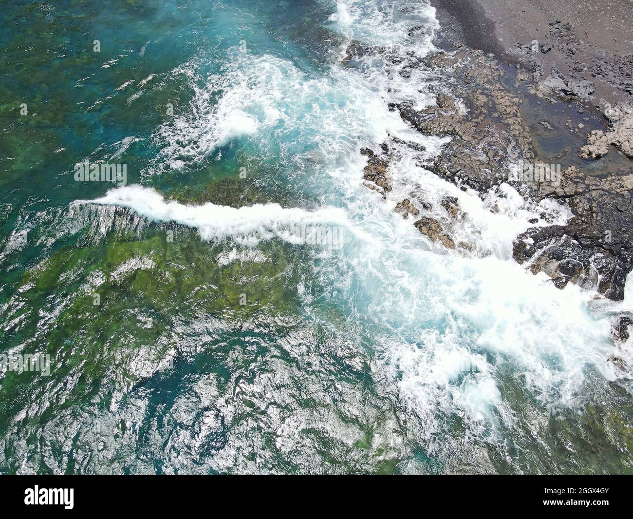 High angle drone shot of the rough and blue Atlantic Ocean with ...