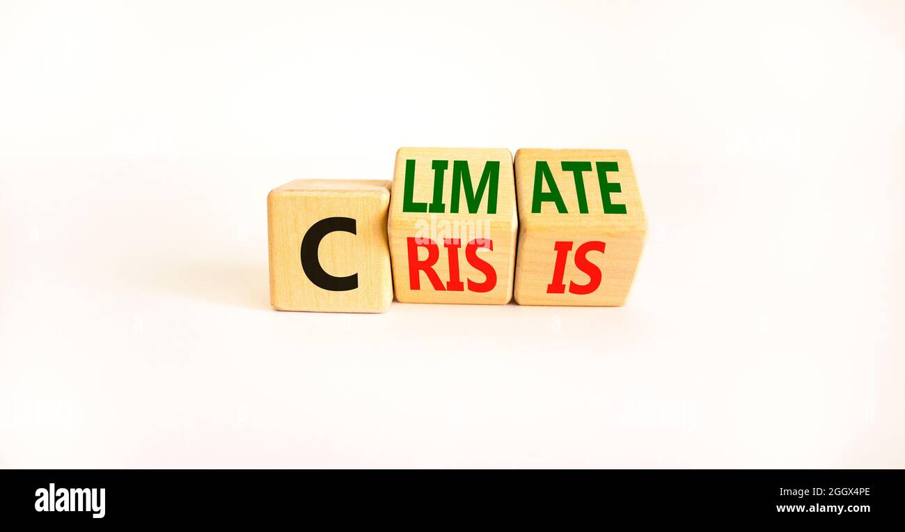 Climate crisis and change symbol. Turned wooden cubes with words ...