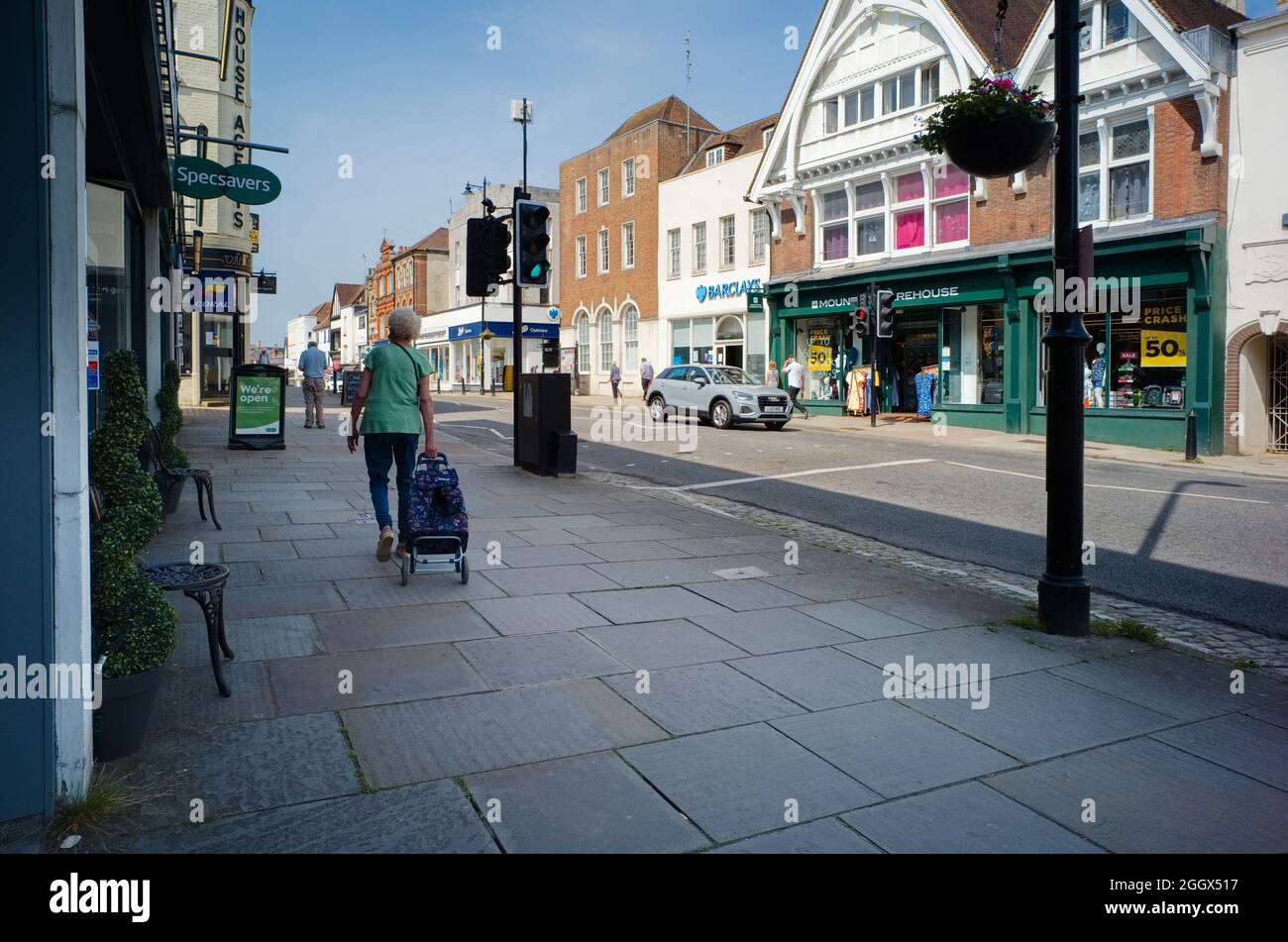 Shops and shoppers in the High Street at Dorking, Surrey Stock Photo ...