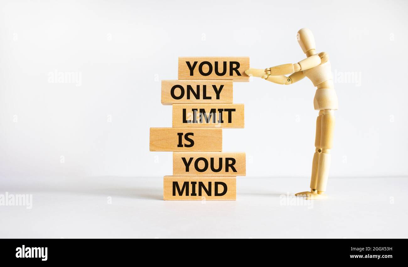 Your only limit is your mind symbol. Wooden blocks with words 'Your ...