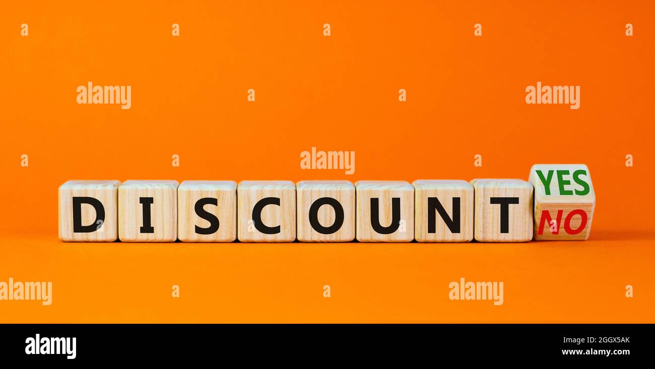 Discount symbol. Turned a wooden cube and changed words 'discount no ...