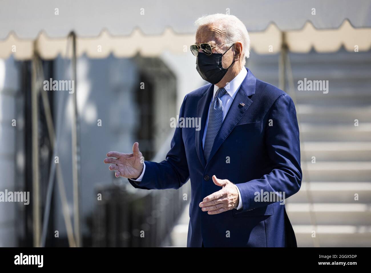 US President Joe Biden speaks briefly to the media as he departs the ...