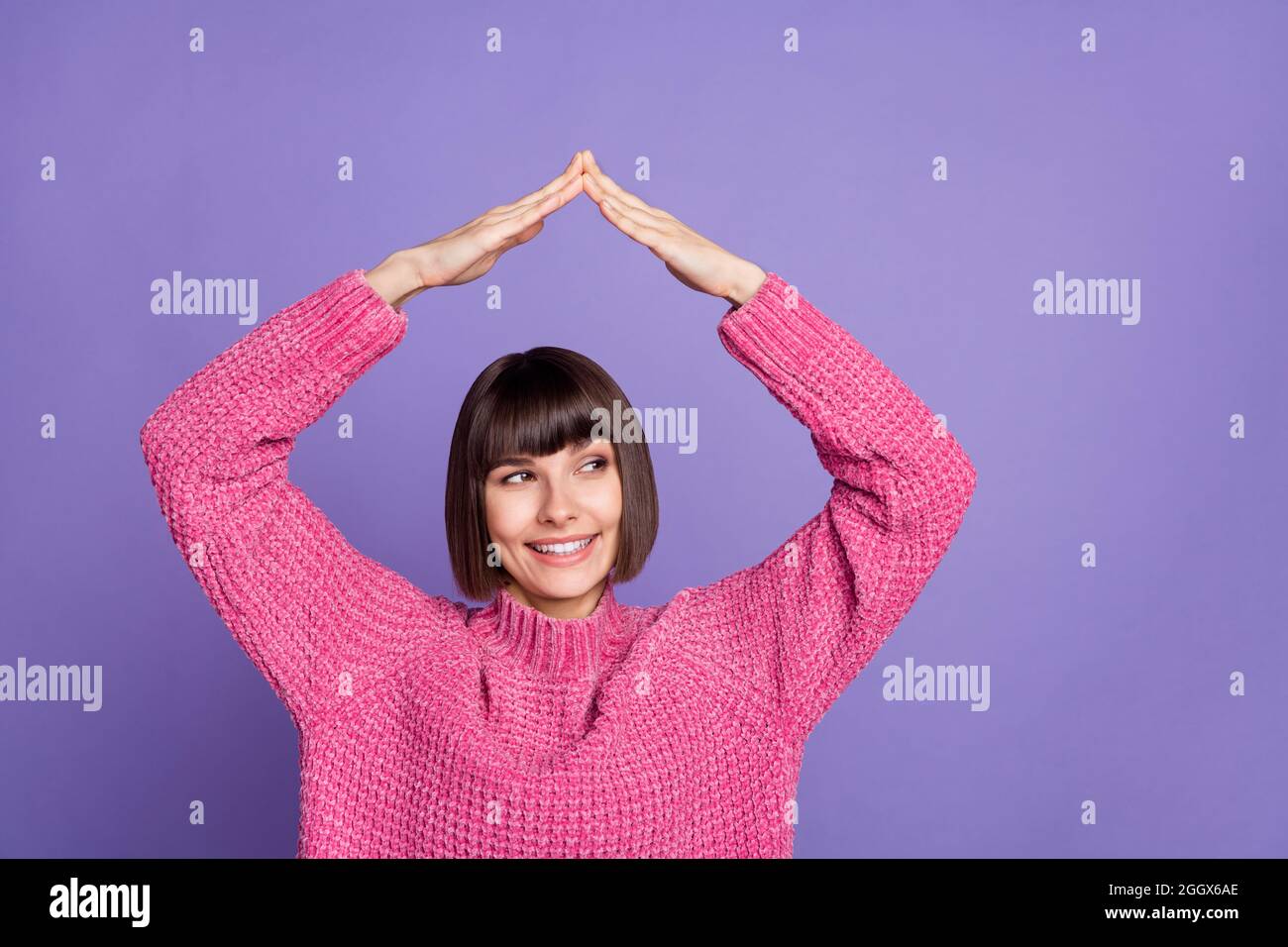 Photo of young smiling dreamy curious girl look copyspace hold hands ...