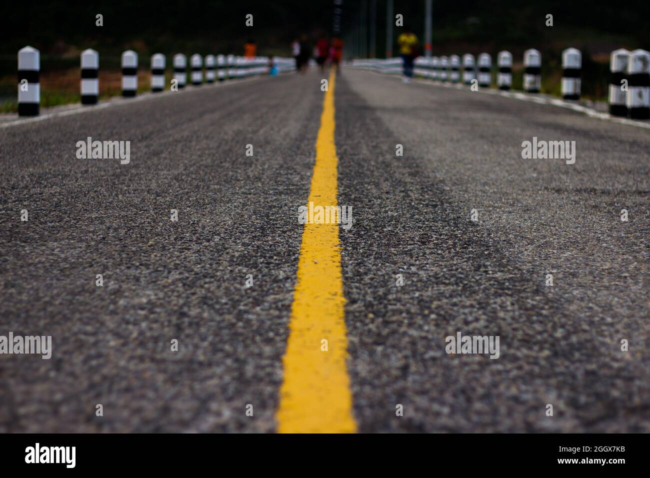 yellow line wiht asphalt road texture. close up Stock Photo - Alamy