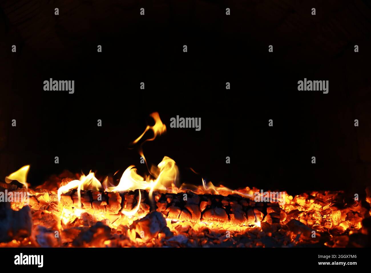 Burning red hot sparks fly from big fire. Beautiful abstract background ...