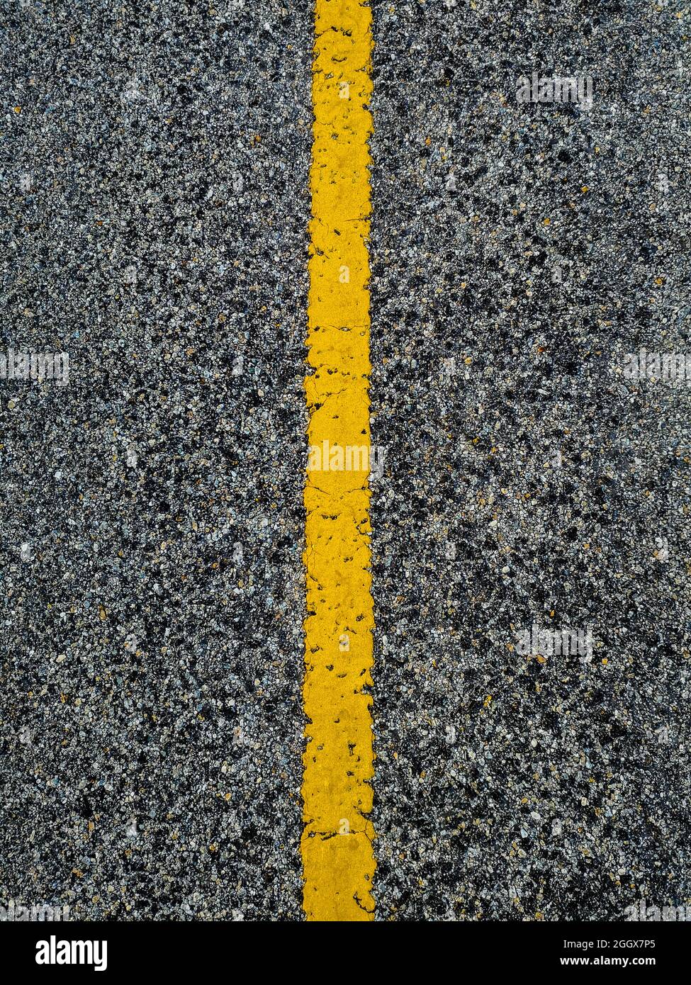 yellow line wiht asphalt road texture. close up Stock Photo - Alamy
