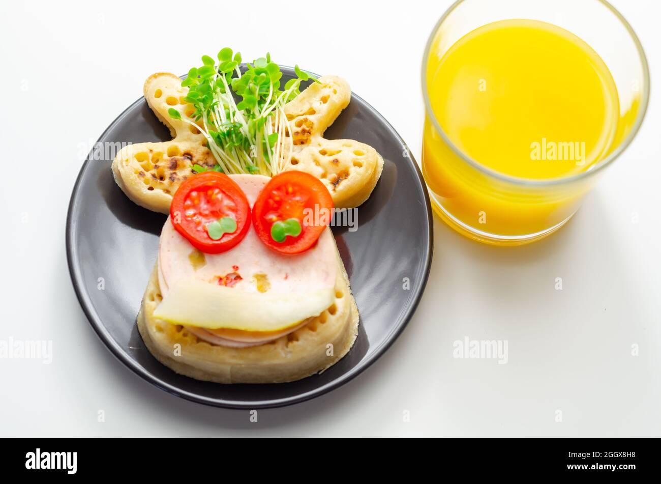 Reindeer shaped crumpets served with ham, tomato, cucumber, and ...