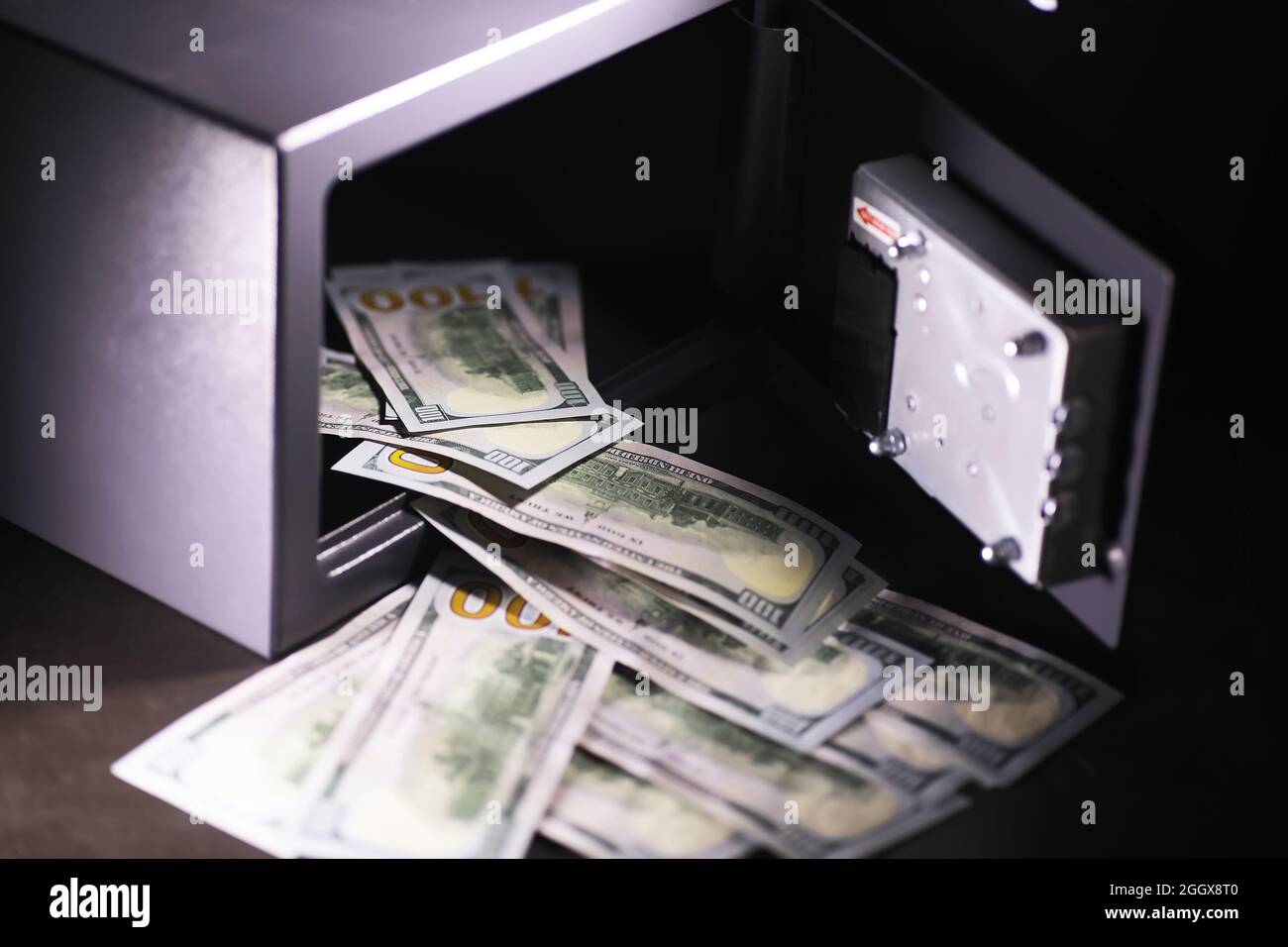 Steel safe with money. Hand putting password in the safety money box in ...