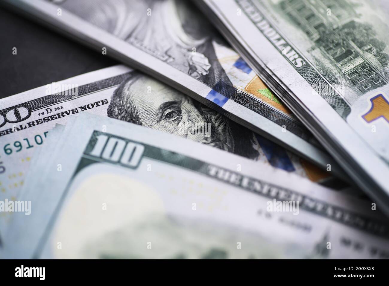 Cash money in a large pile as a finance background. Paper money close ...
