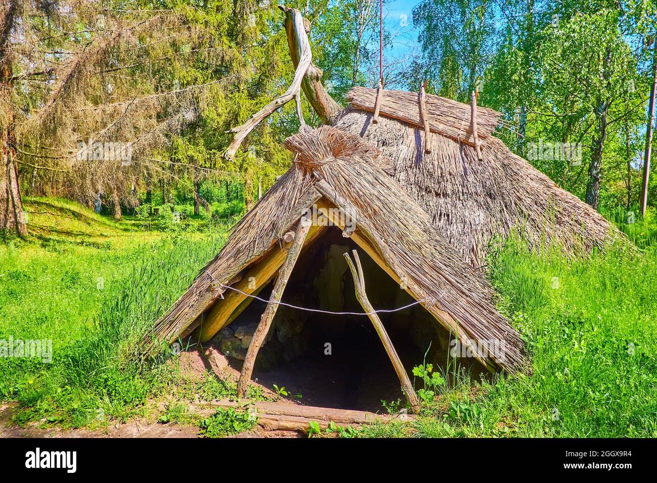 The example of ancient Slavic wooden pit-house with thatched roof ...