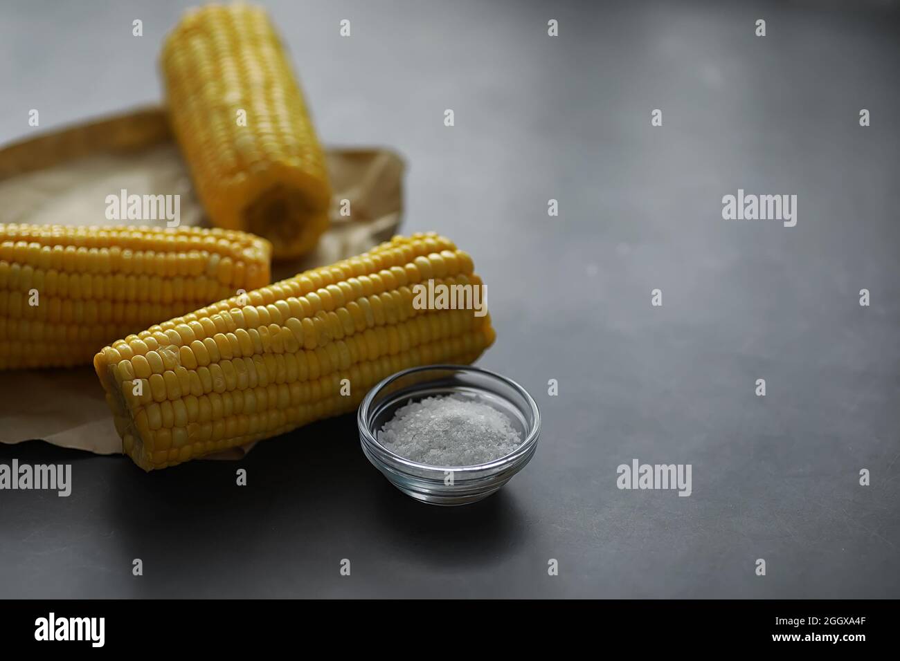 Freshly made fragrant ear of corn with salt. Farm snack fresh corn ...