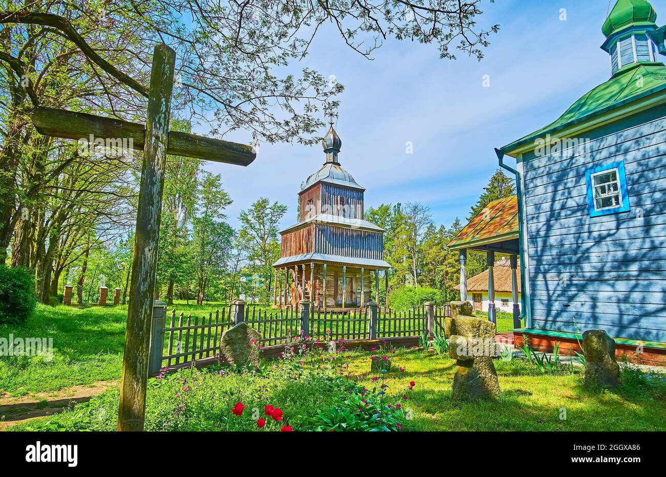 The old wooden village Intercession Church with a small cemetery and ...