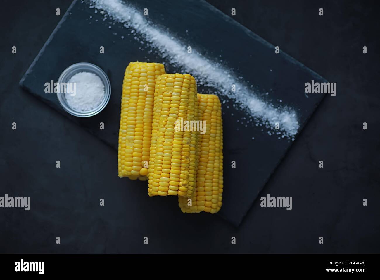 Freshly made fragrant ear of corn with salt. Farm snack fresh corn ...