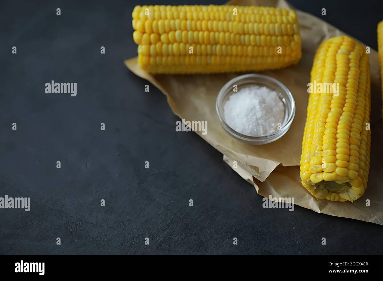 Freshly made fragrant ear of corn with salt. Farm snack fresh corn ...