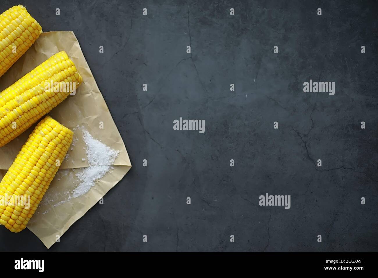 Freshly made fragrant ear of corn with salt. Farm snack fresh corn ...