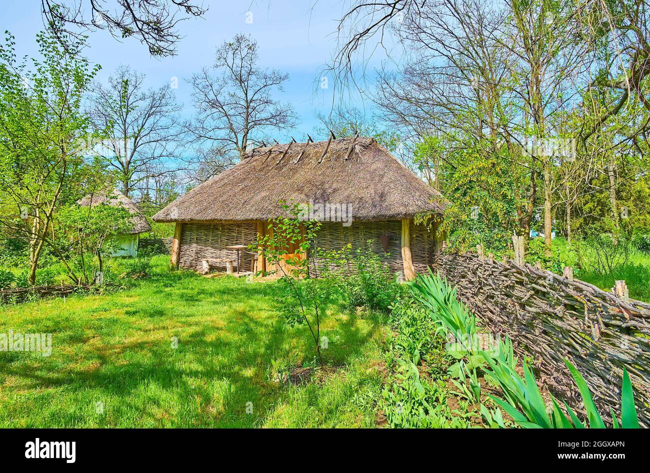 The green lawn in front of the vintage wicker barn with traditional ...