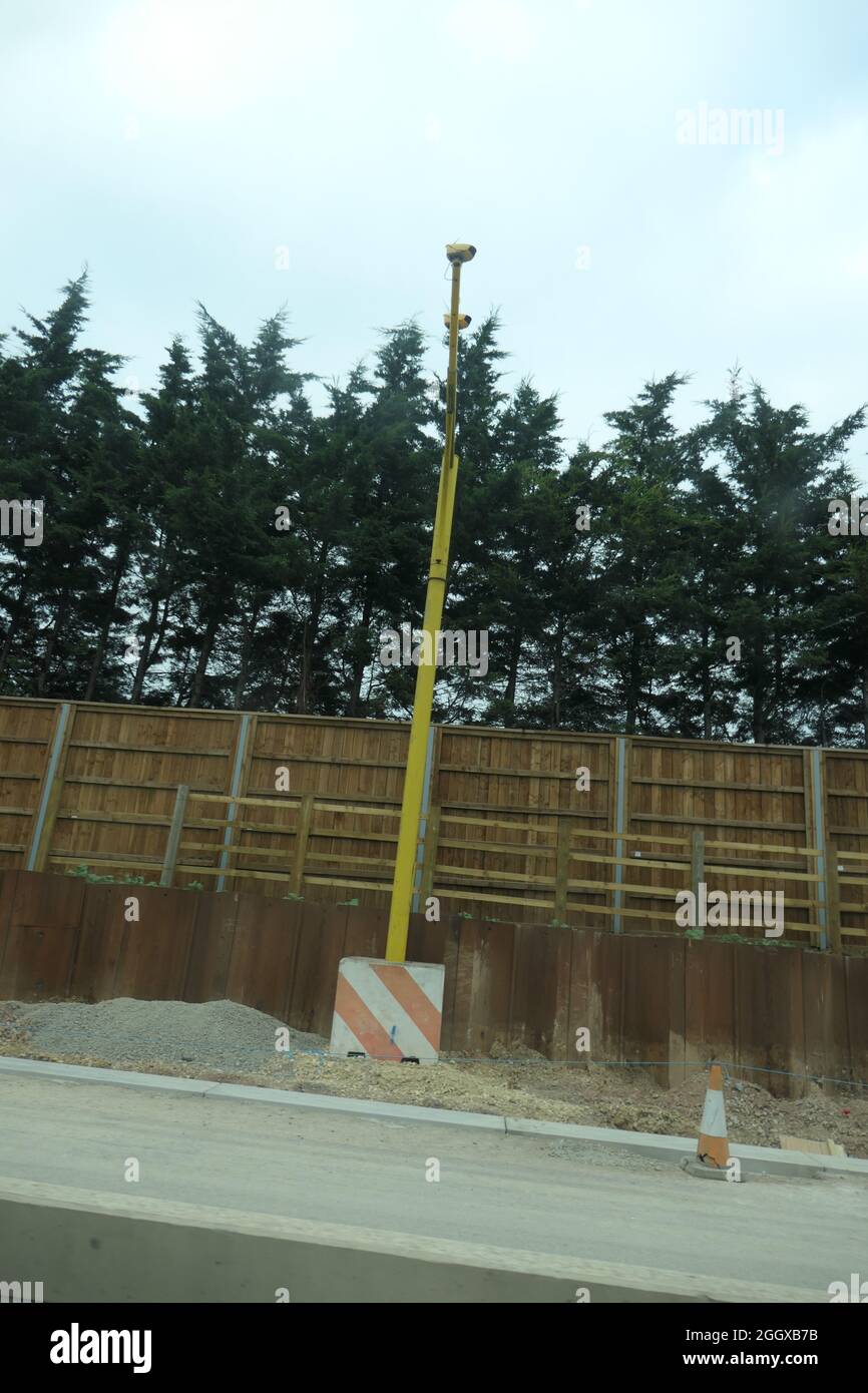 Speed camera on a pole M1 motorway Northamptonshire UK fence M1 road ...