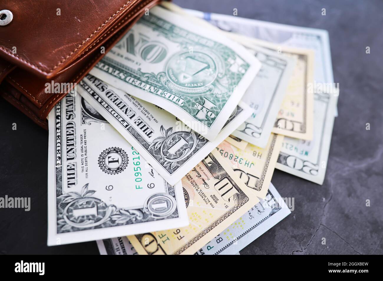 Cash money in a large pile as a finance background. Paper money close ...