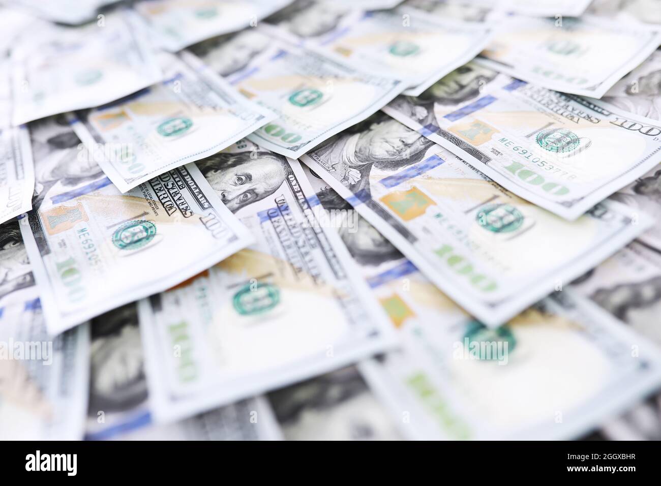 Cash money in a large pile as a finance background. Paper money close ...