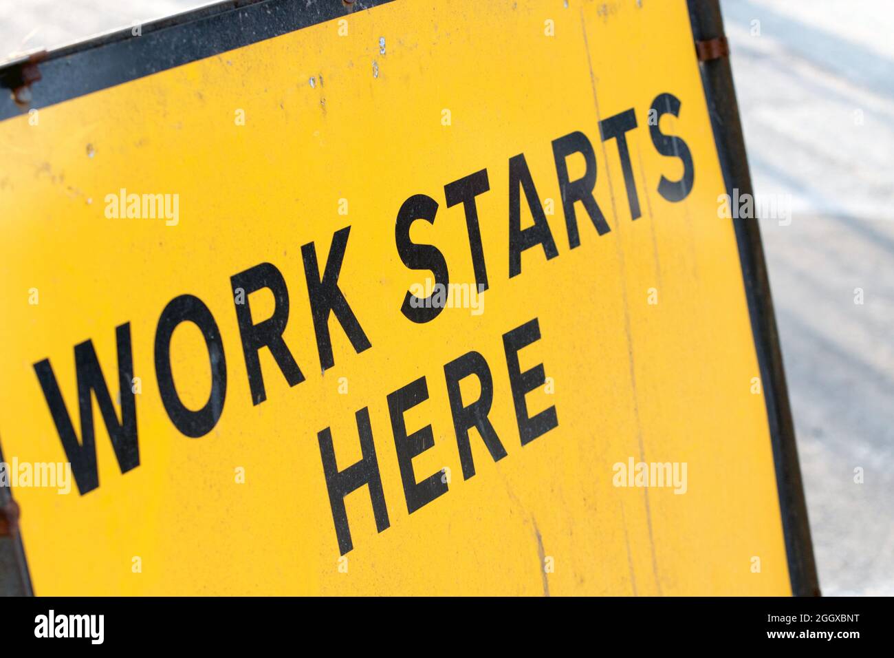 Work starts here road workers sign Stock Photo - Alamy