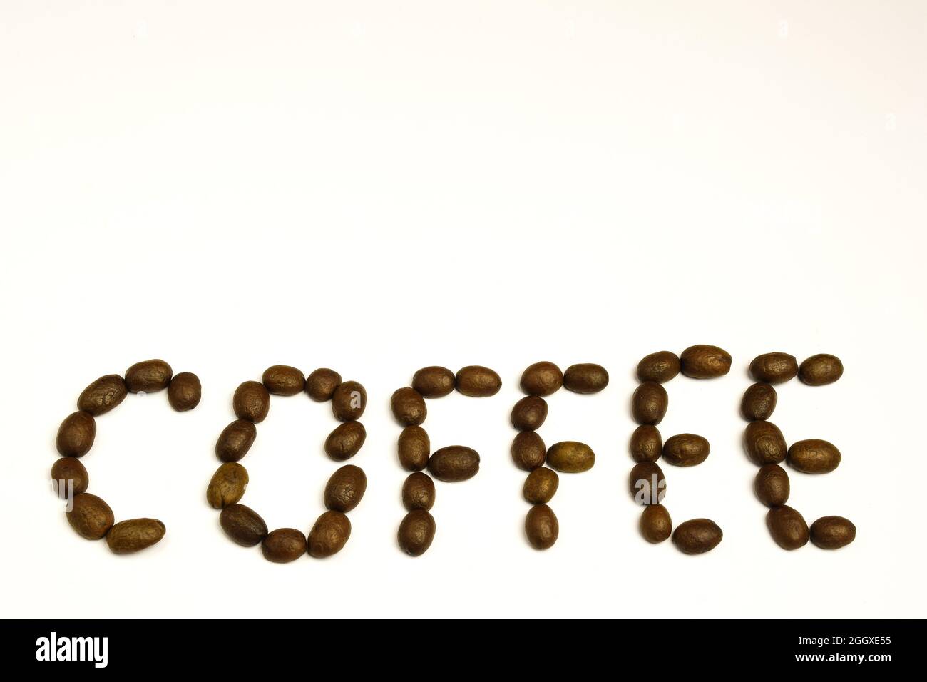 On white blank background coffee beans laid out word COFFEE Stock Photo ...
