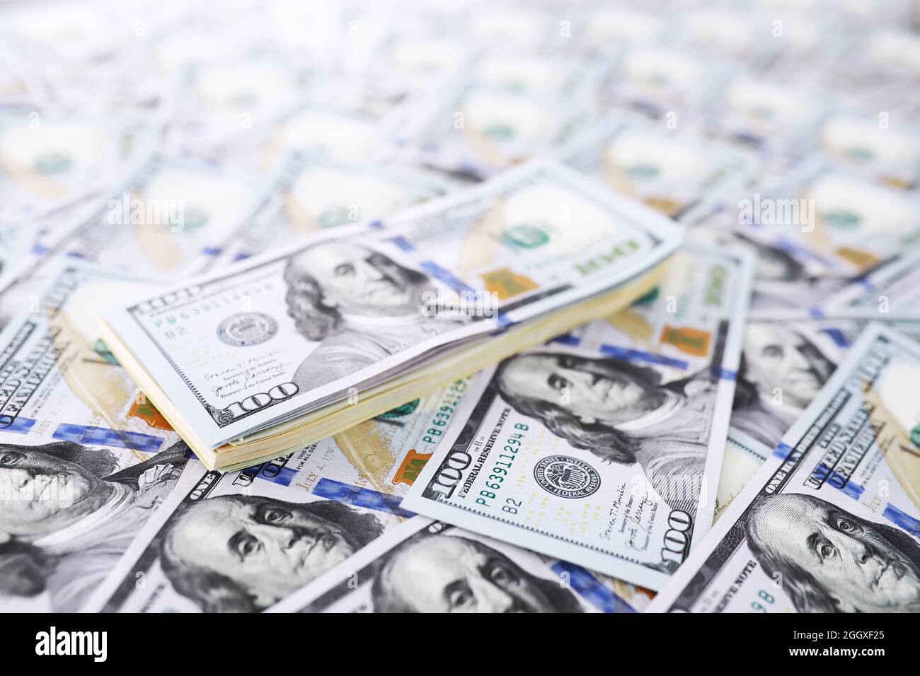 Cash money in a large pile as a finance background. Paper money close ...