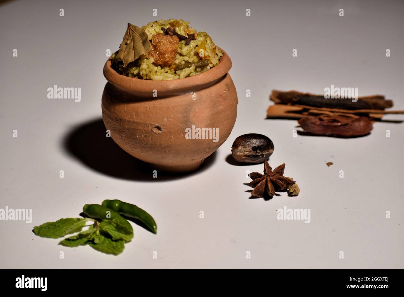A high view shot of tasty vegetable pallav made of rice kept in earthen ...