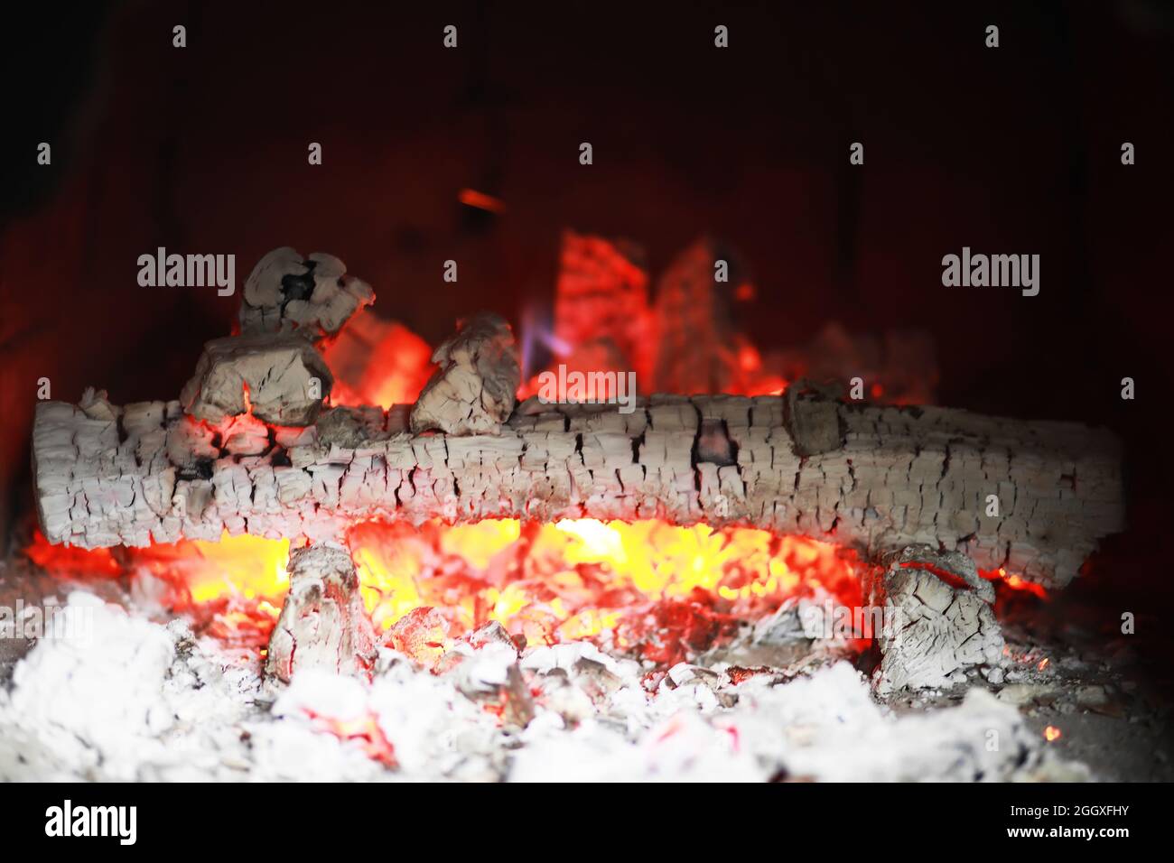 Burning red hot sparks fly from big fire. Burning coals, flaming ...