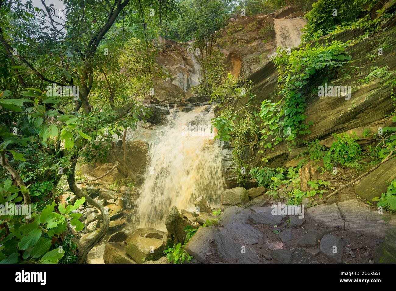 Beautiful Bamni waterfall having full streams of water flowing downhill ...